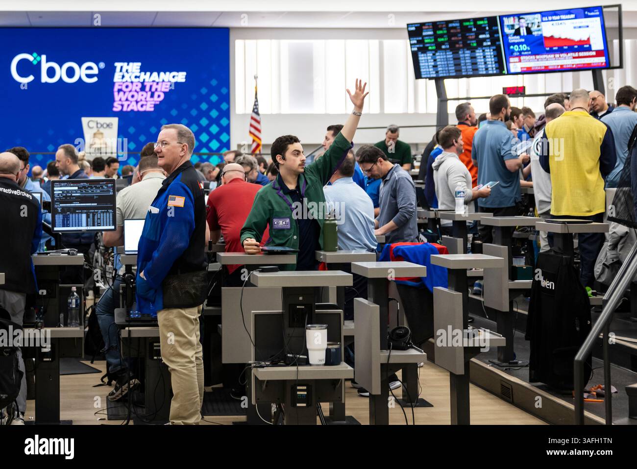 Traders work in the S&P options pit at the Cboe Options Exchange in the ...