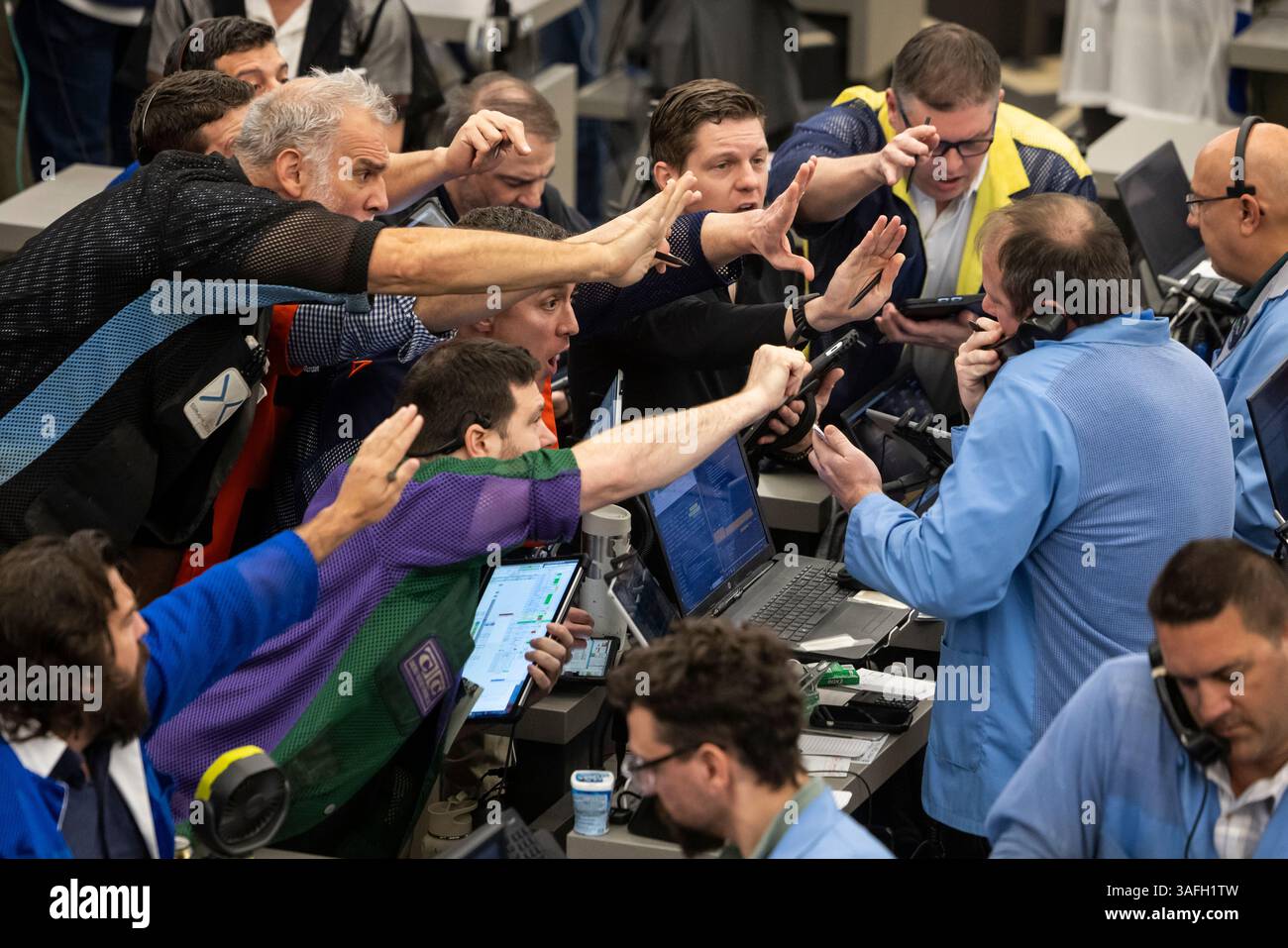 Traders work in the S&P options pit at the Cboe Options Exchange in the ...