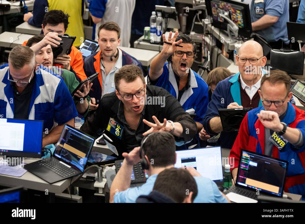Traders work in the S&P options pit at the Cboe Options Exchange in the ...