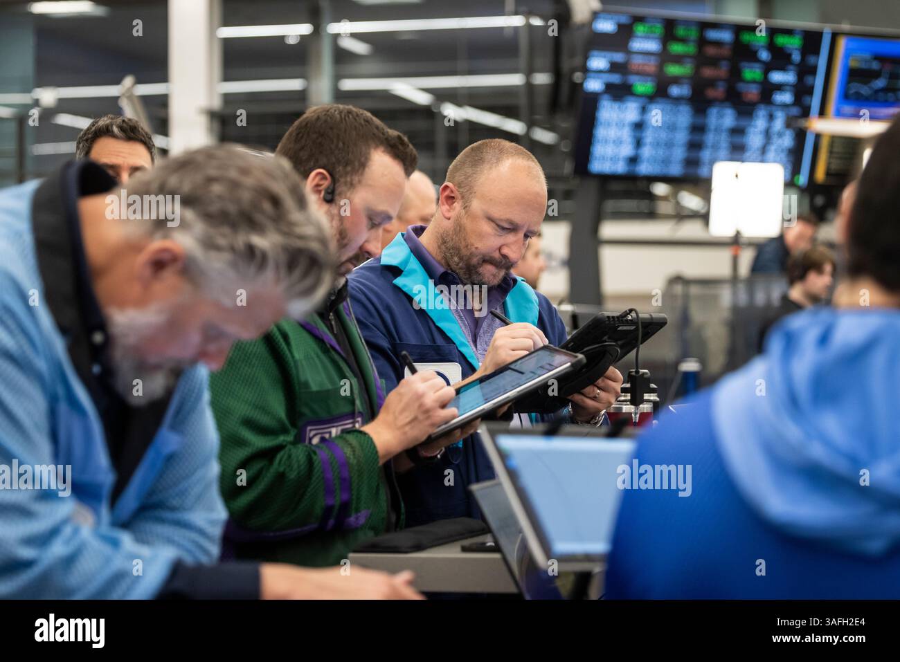 Traders work in the S&P options pit at the Cboe Options Exchange in the ...