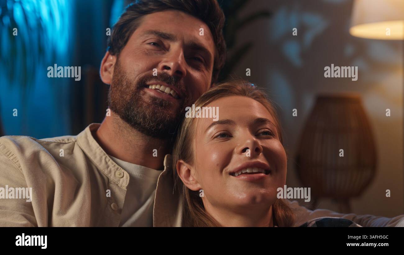 Loving couple relax at home happy Caucasian family wife husband embrace ...