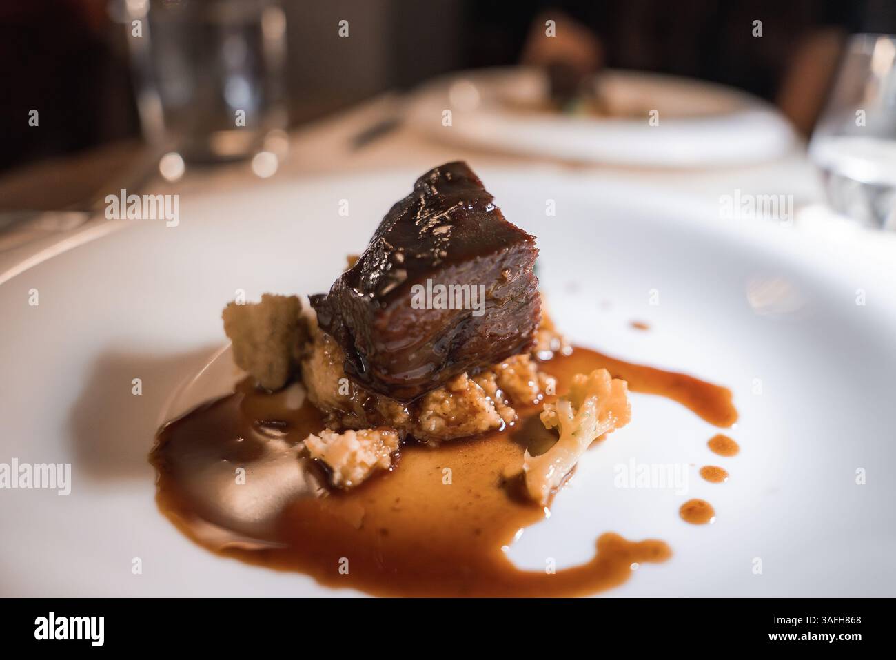 Gourmet Braised Meat Dish with Artistic Presentation in Fine Dining ...