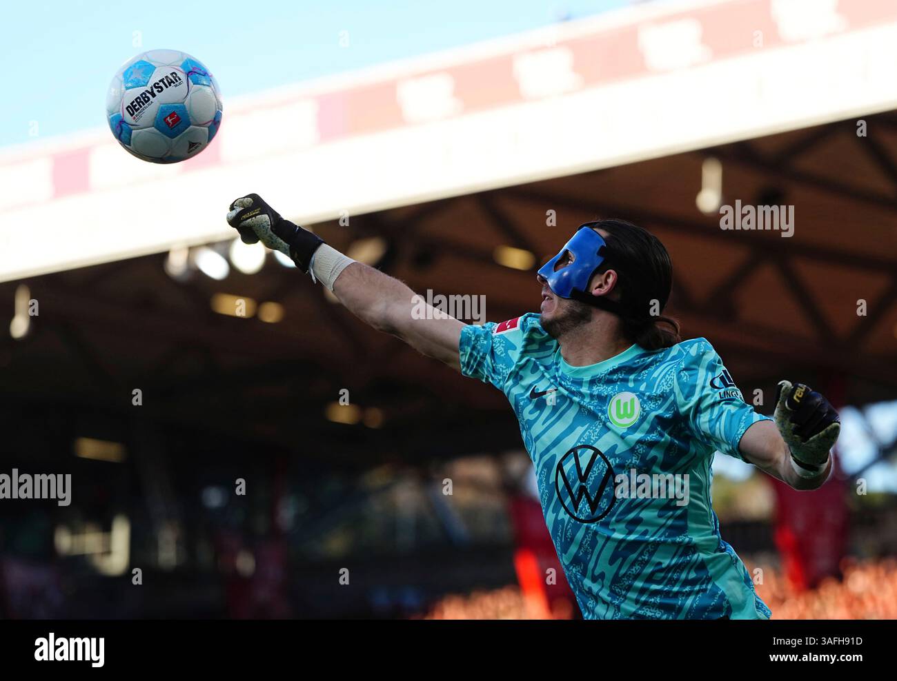 April 06 2025: Kamil Grabara of VfL Wolfsburg controls the ball during ...