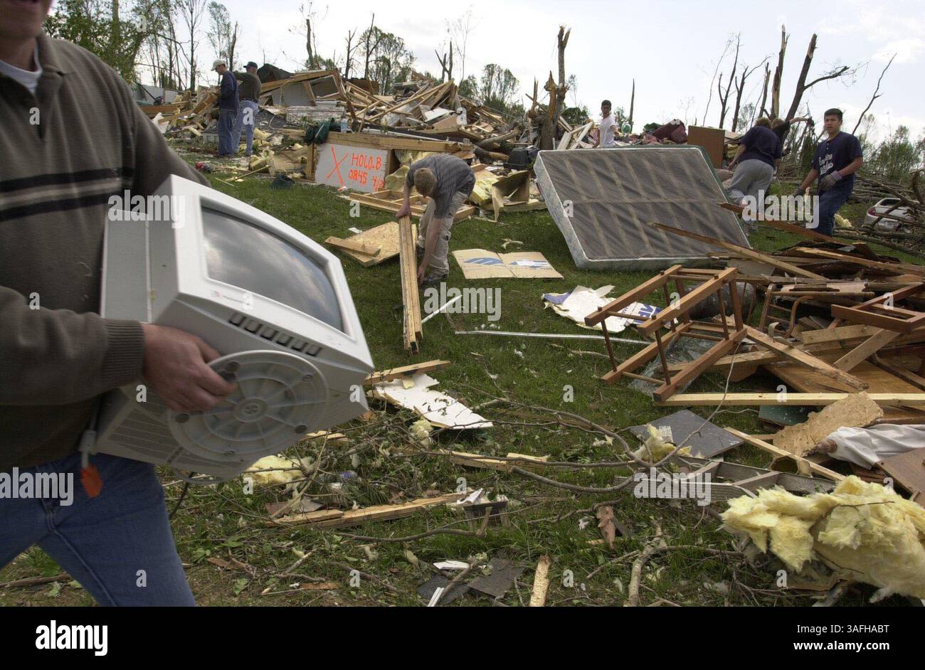Neighbors, friends and family help clean up after a tornado destroyed ...