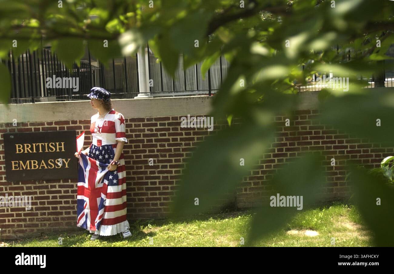 Karen Szulgit is dresed in the colors of the U.S. flag while holding a ...