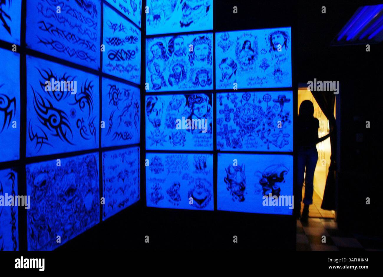 Black Light illuminates pre-printed tattoo designs in the hallway that ...