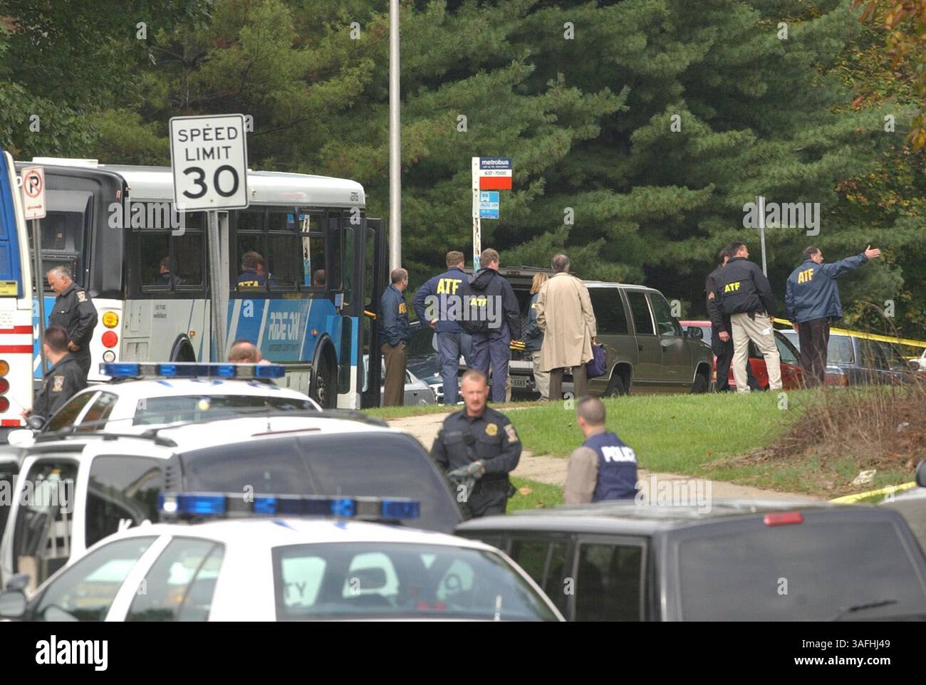 ATF agents investigate the scene of a shooting on Grand Pre road at ...