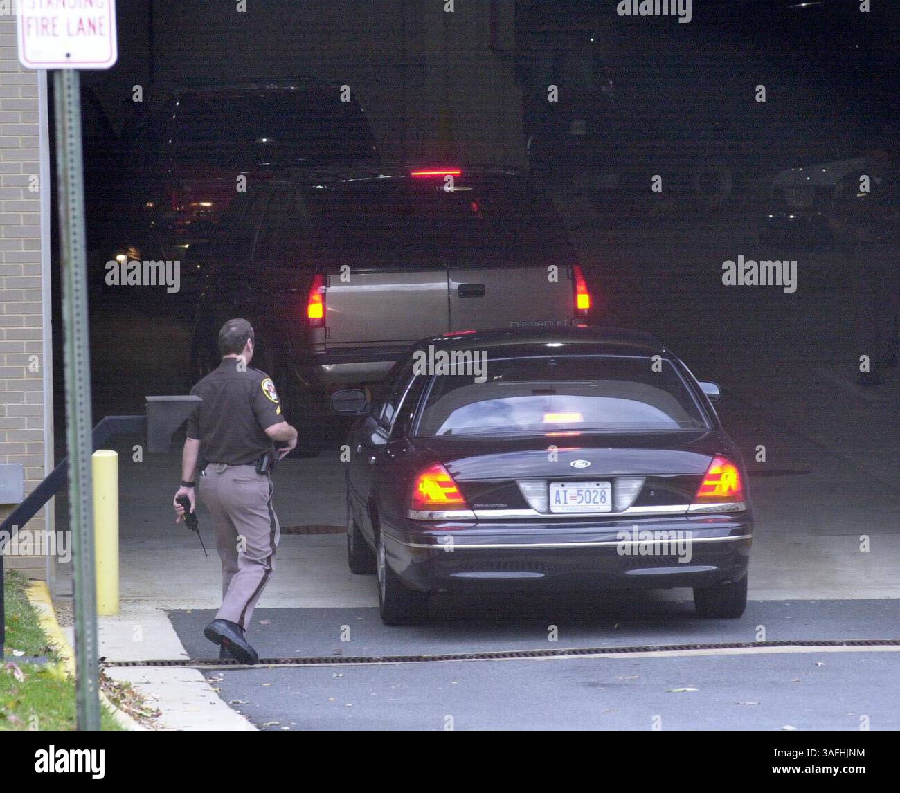 A motorcade believed to be transporting sniper suspect John Lee Malvo ...