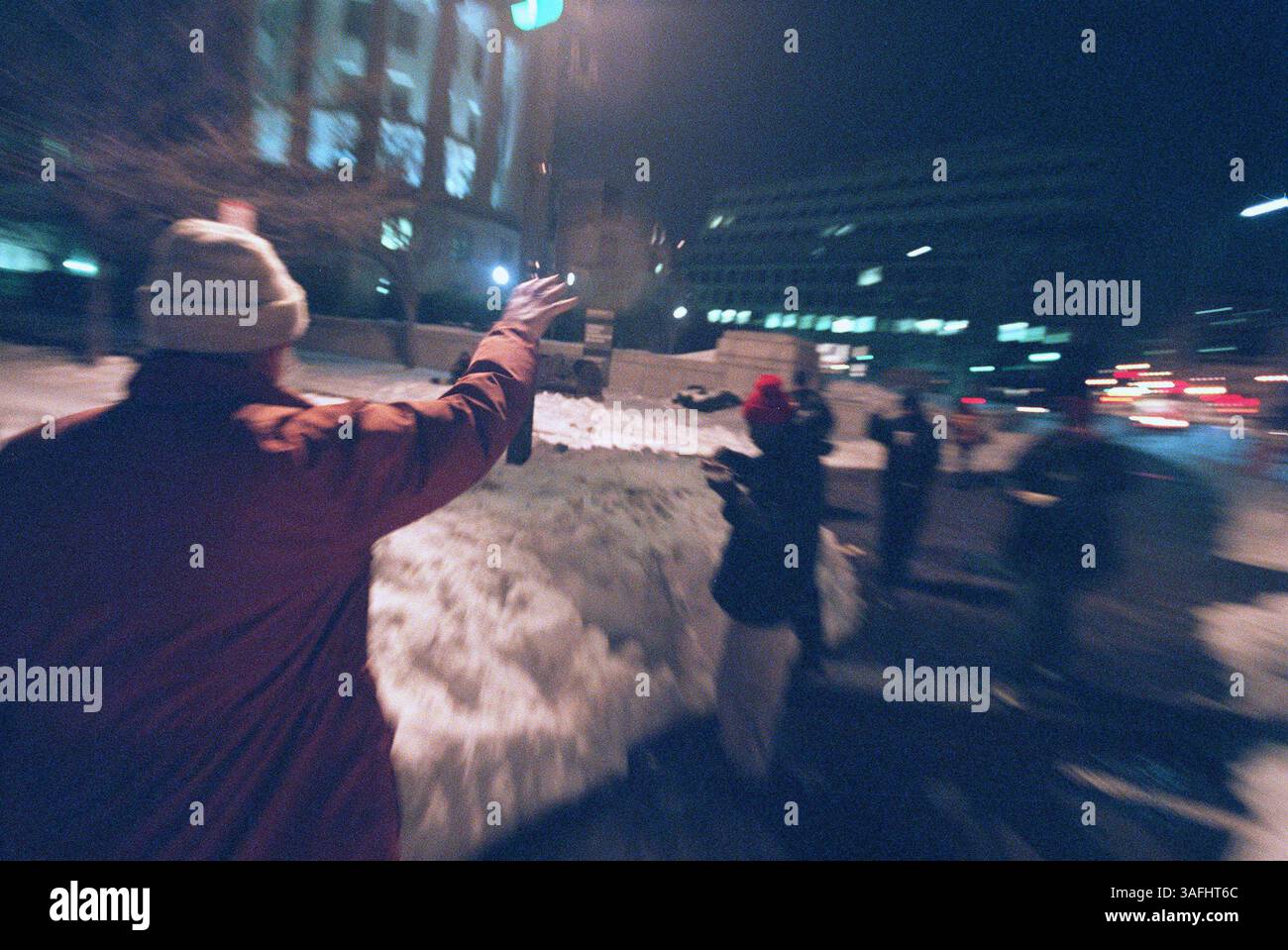 Salvation Army volunteer Pete Schenck, left, waves good-bye to some men ...