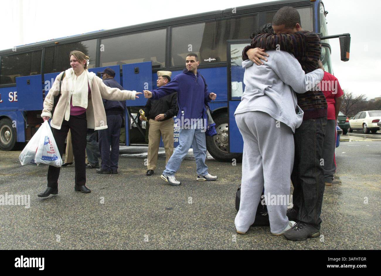 Lamond Edwards hugs his wife Latoya Edwards, an HM3 with the Navy ...