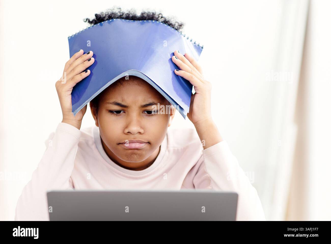 Schoolgirl getting grade sitting hi-res stock photography and images ...