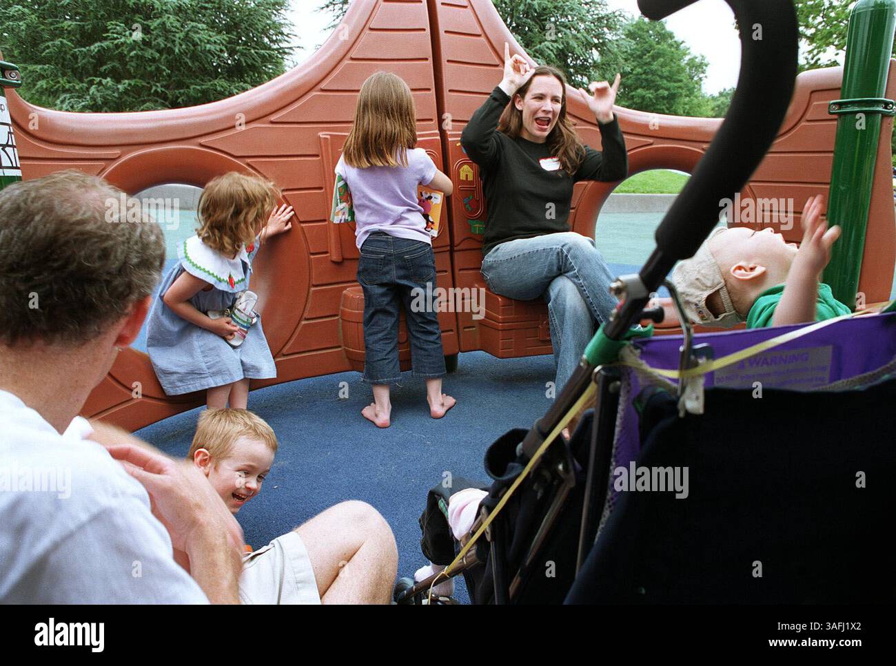Rachel Coleman of Salt Lake City, Utah, signs parts of ''Who Will Help ...