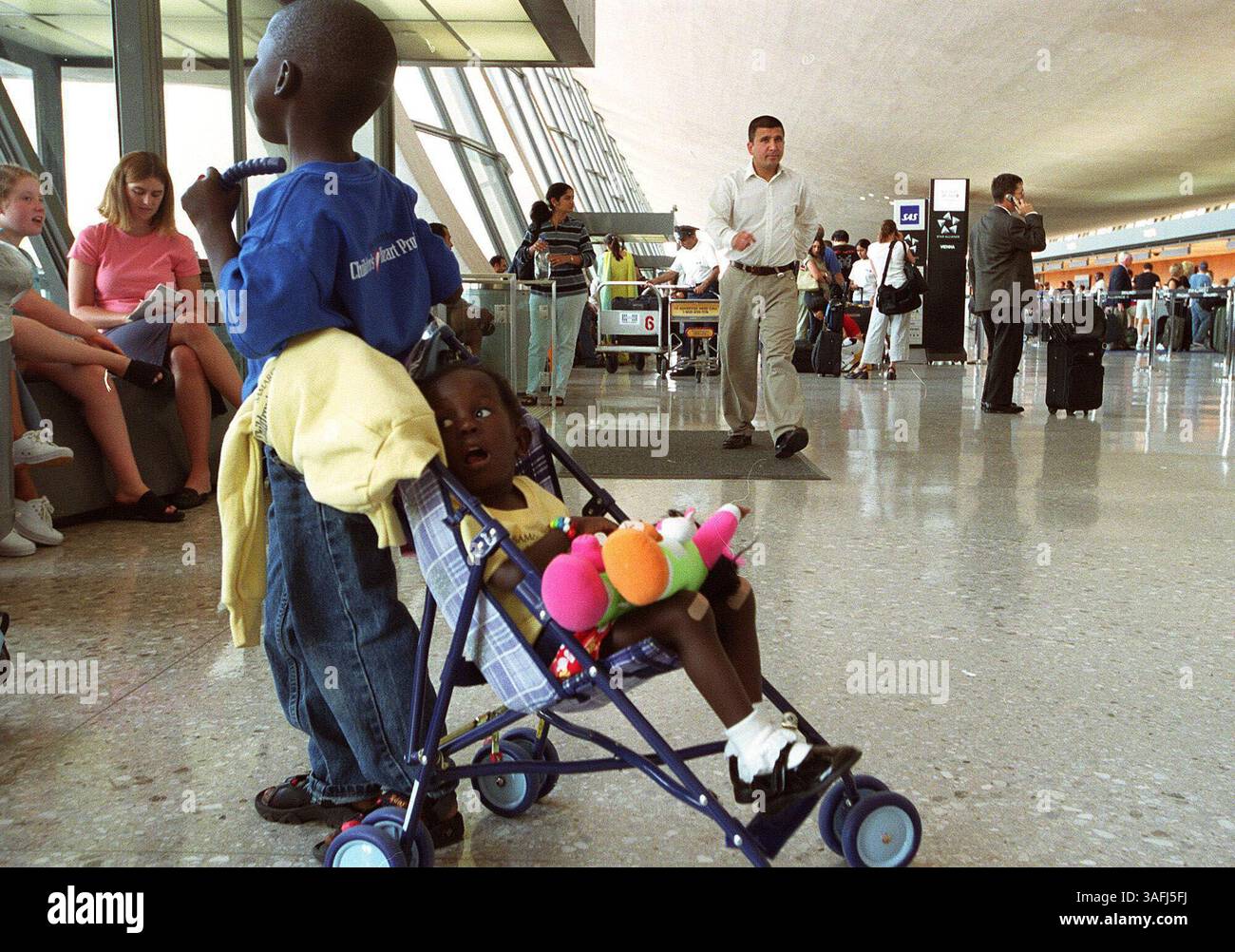 Five year-old Hassan Bukenya and Deborah Lwanga get ready to say good ...