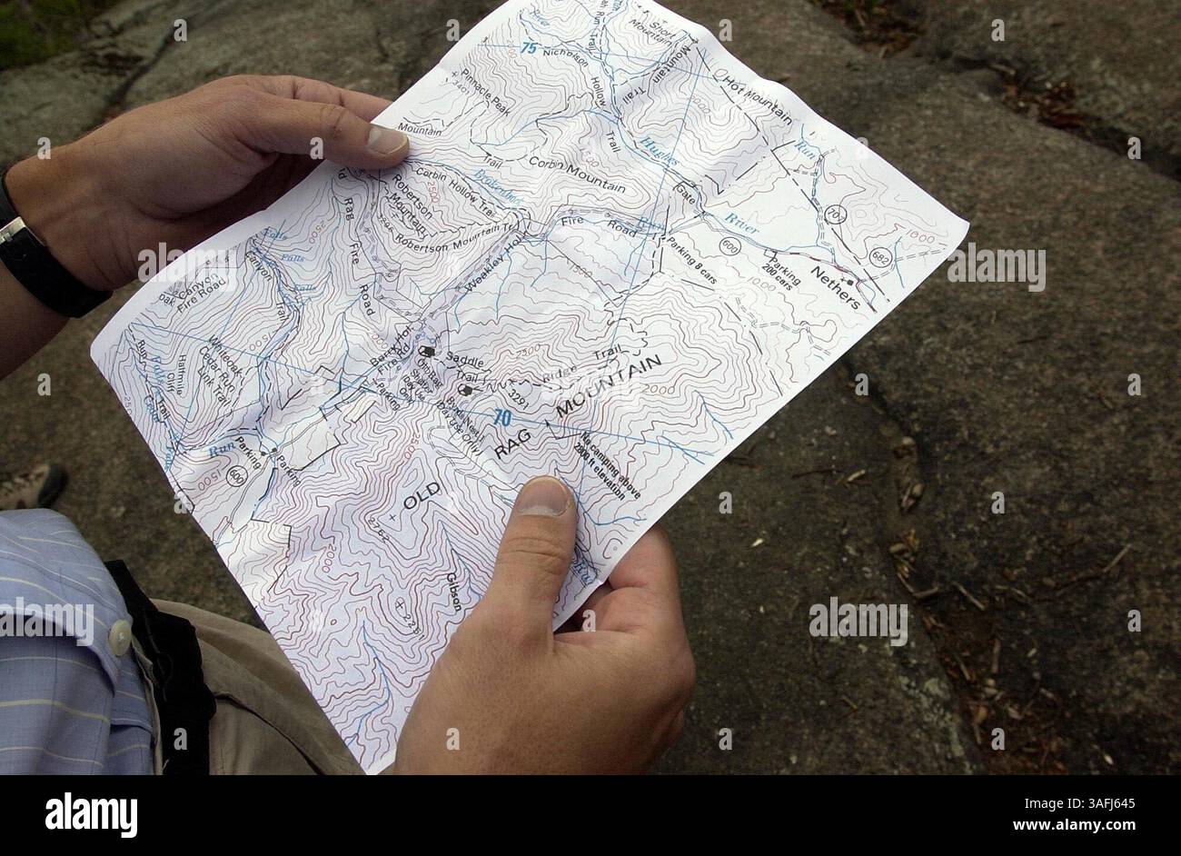 Richard Meinhold of the Capital Hiking Club looks over a topographical ...