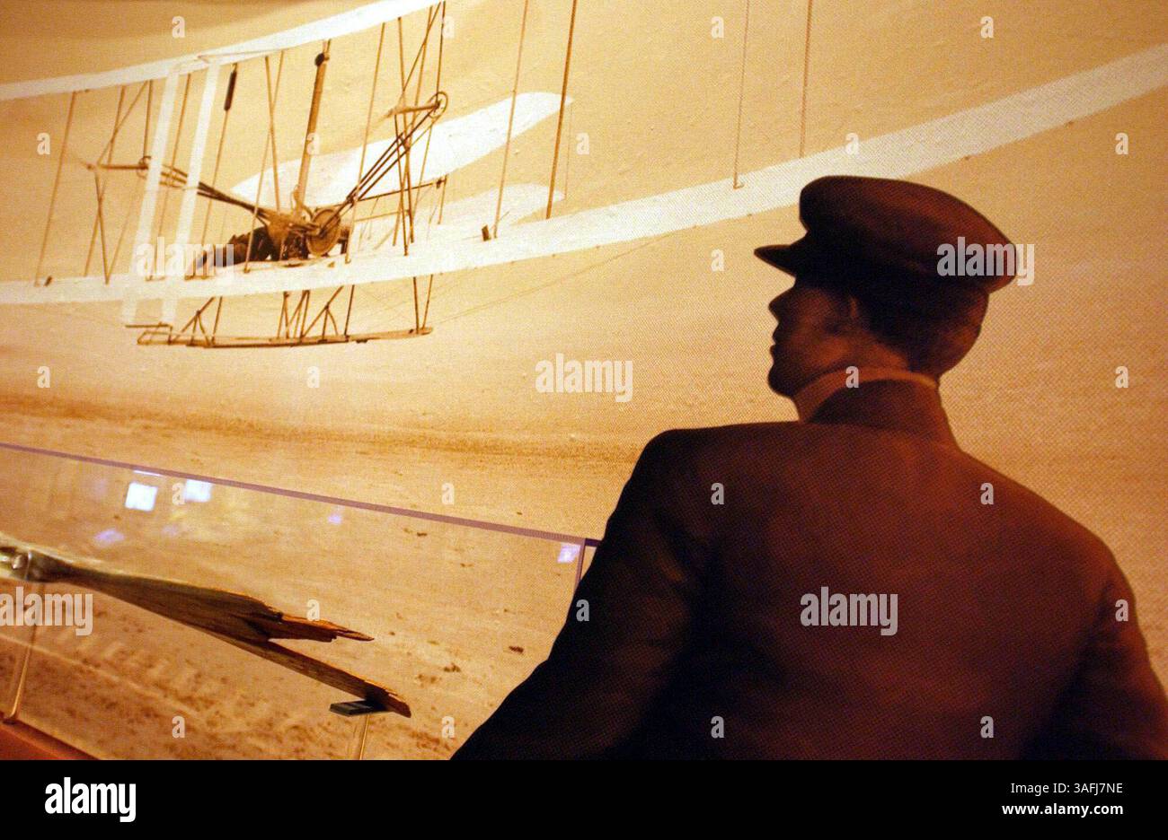 A billboard-size photograph, showing the flight of the 'Wright Flyer ...