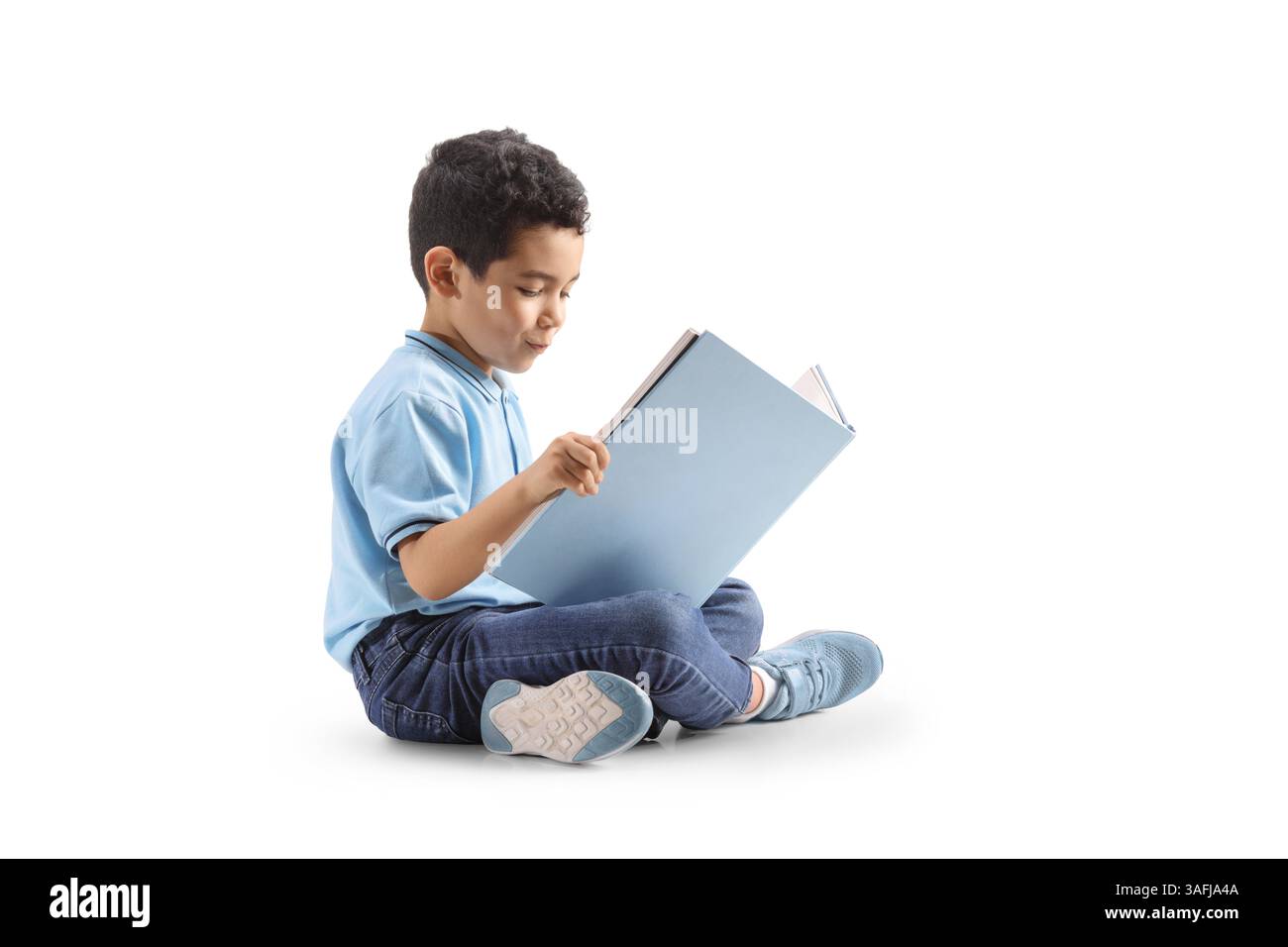 Asian kid sitting and reading book isolated on white background Stock ...