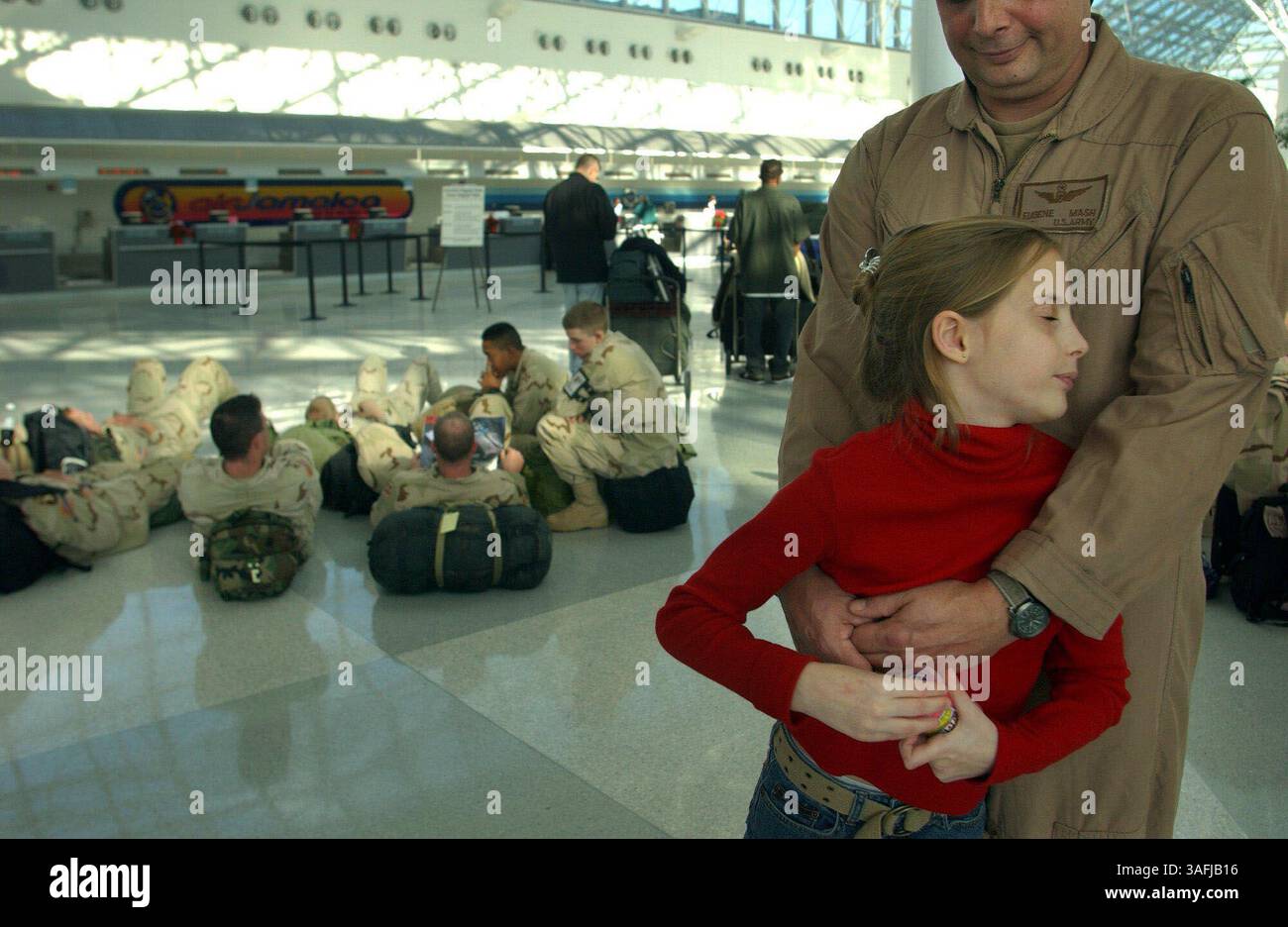 Standing on her father's feet, Katelyn Gill-Mash, 8, of Yorktown, VA ...