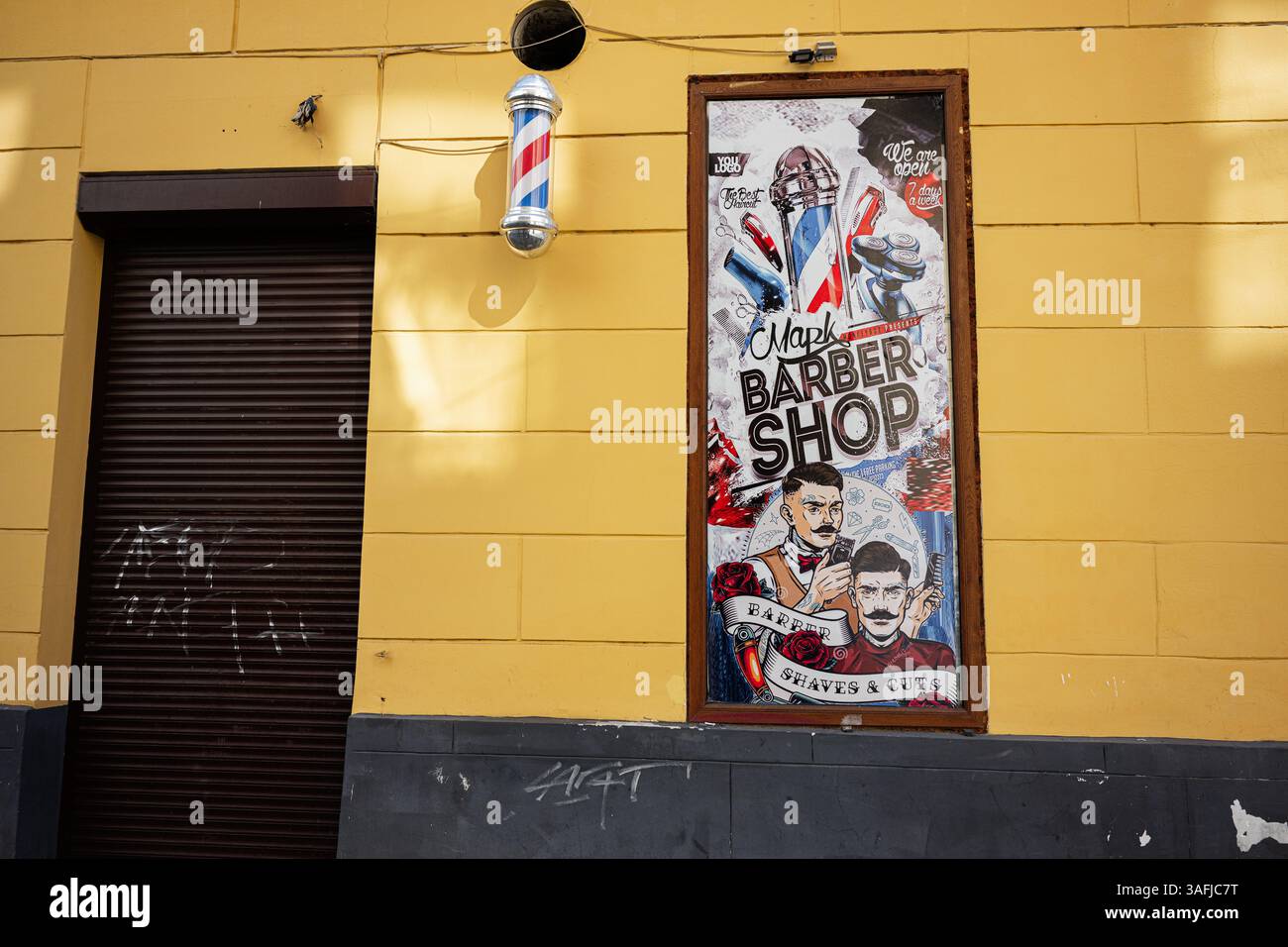 Lviv, Ukraine - April 06, 2025: Barber shop sign and pole placed on a ...