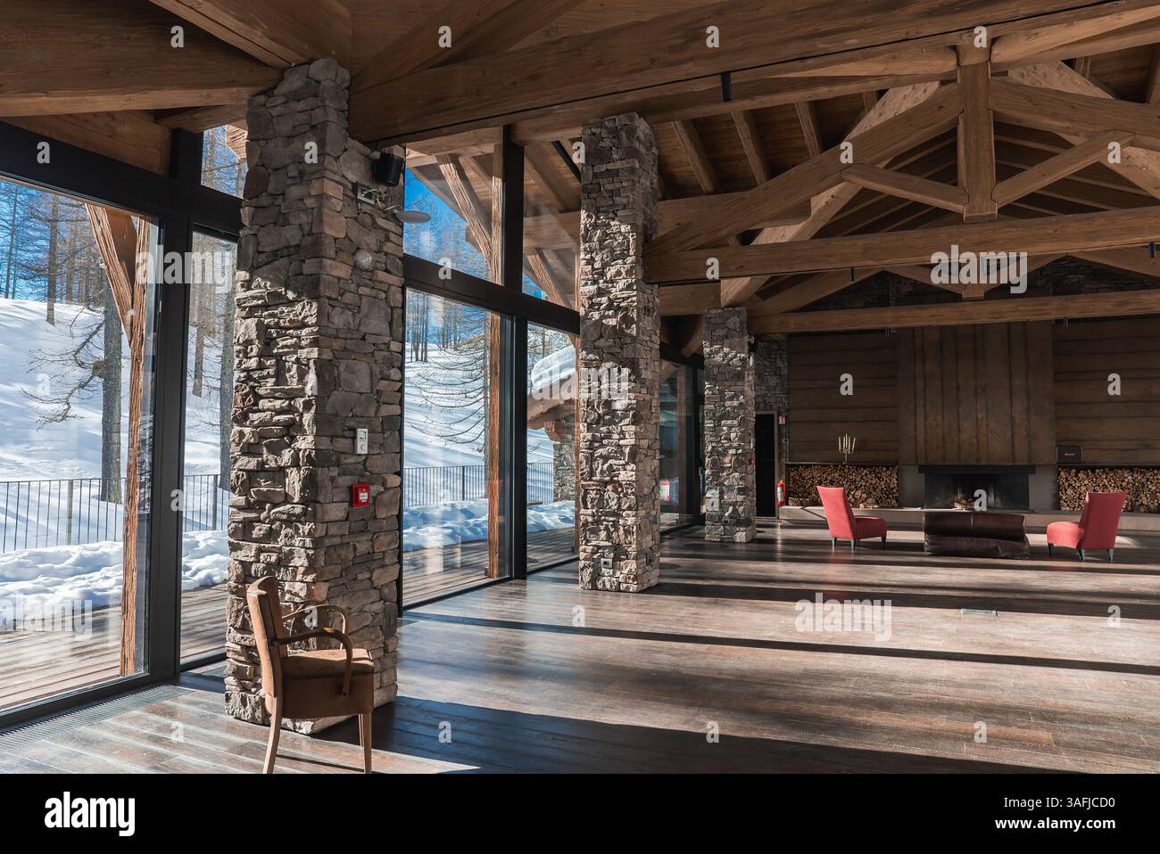Interior of Luxury Alpine Hotel with Fireplace and Snowy Views Stock ...