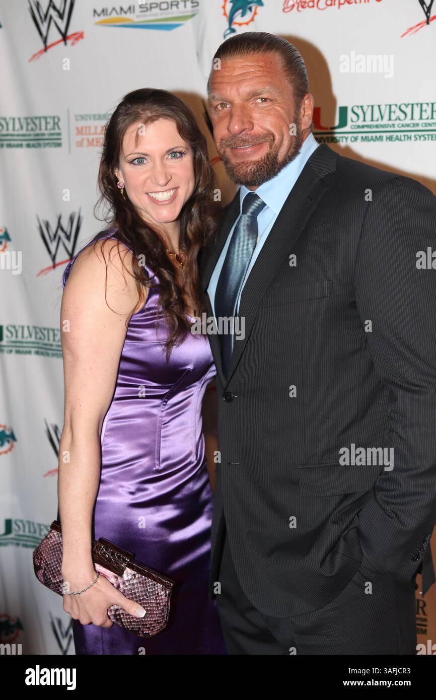 Triple H and wife, Stephanie McMahon poses for media on the red carpet ...