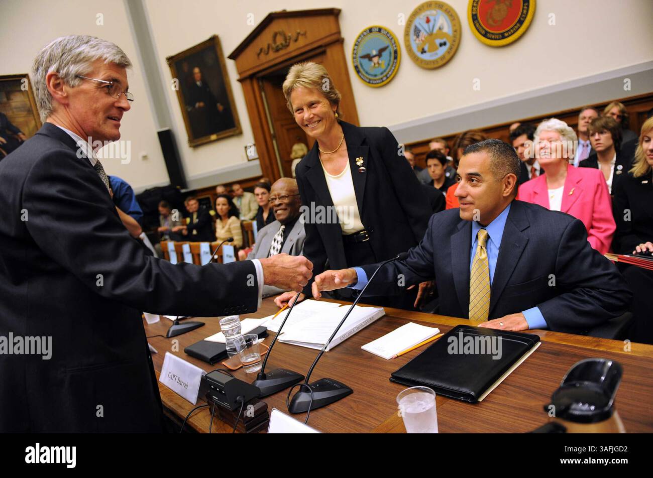 Rep. John M. McHugh (R-NY), left, greets witnesses, Captain Joan E ...
