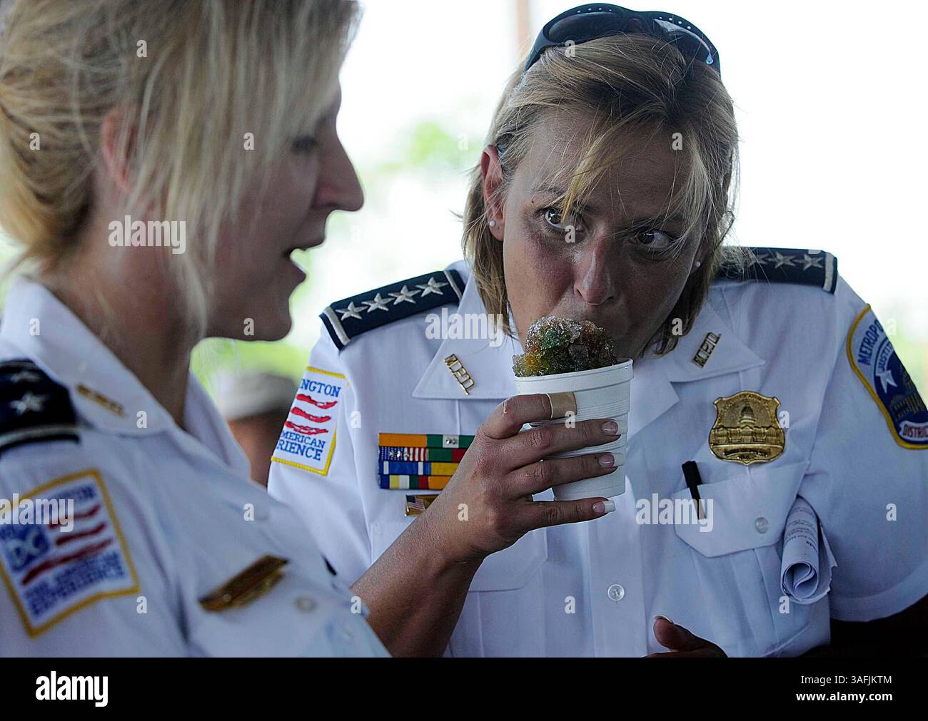 Metropolitan Police Chief Cathy Lanier eats a Sno-Cone made by ...
