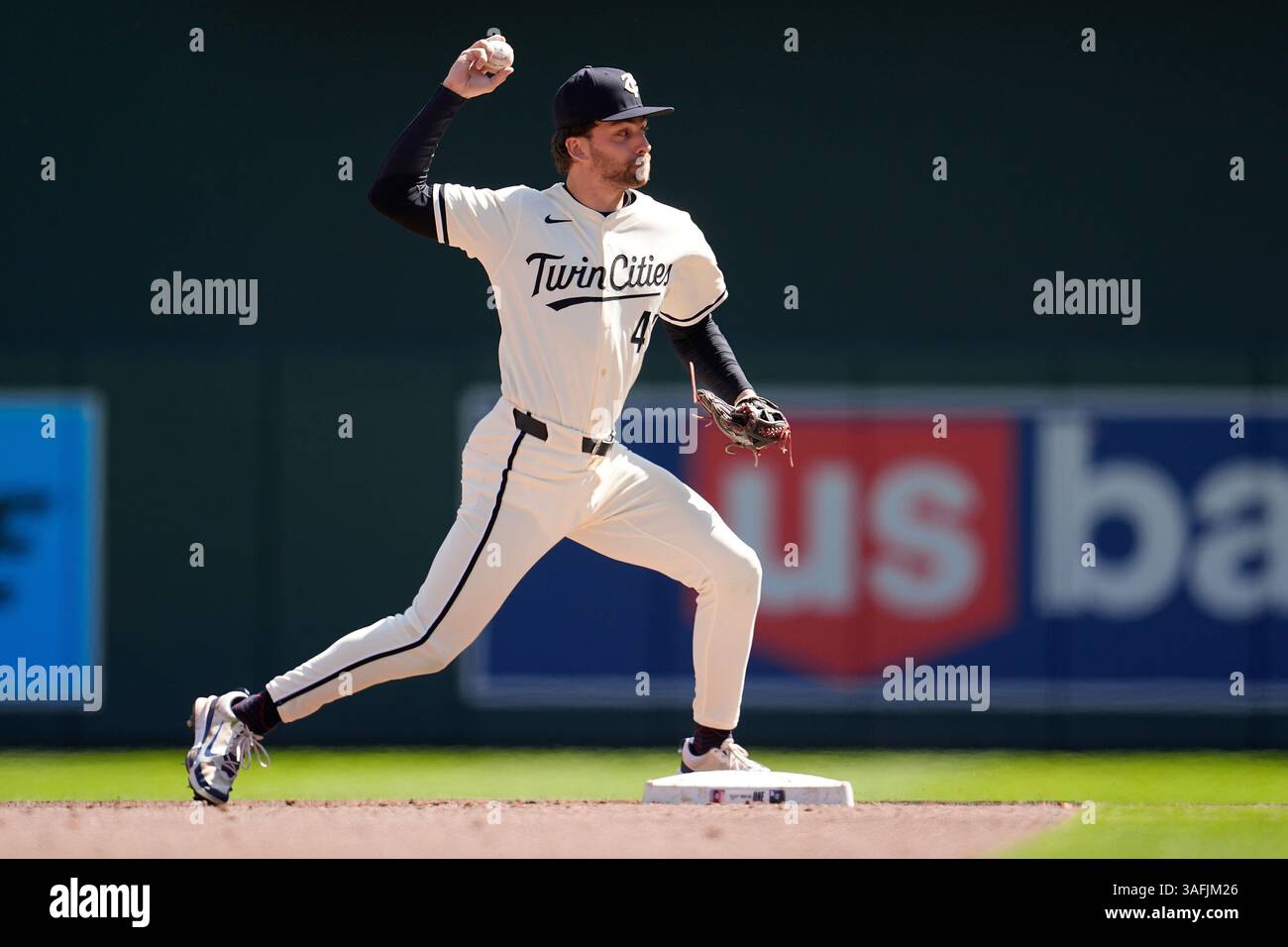 Minnesota Twins second baseman Edouard Julien (47) throws to first base ...