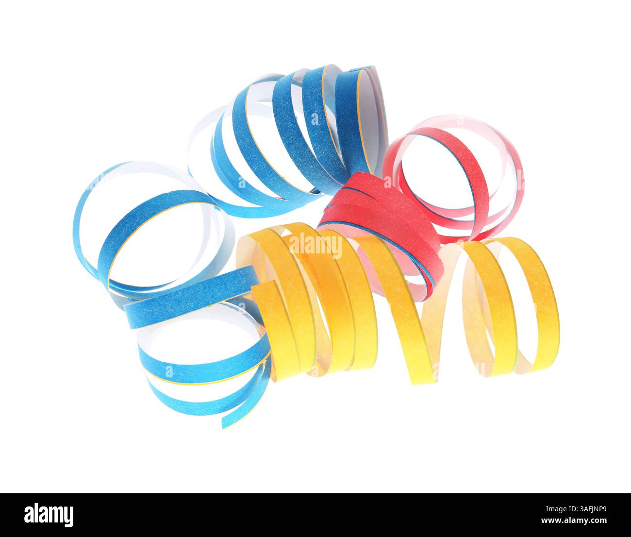 Bright serpentine streamers on white background. Festive decor Stock ...