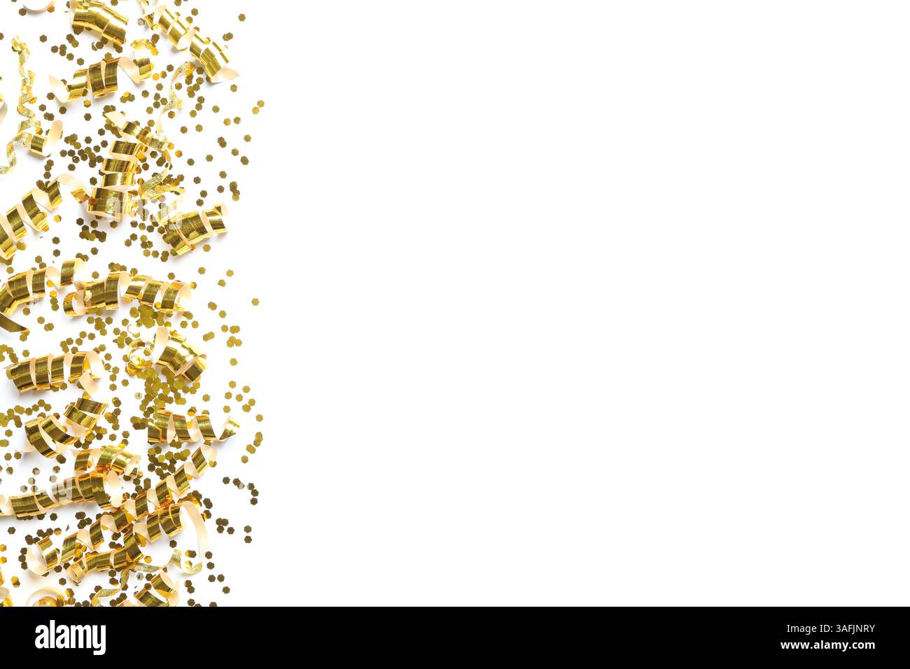 Shiny golden serpentine streamers and confetti on white background, top ...
