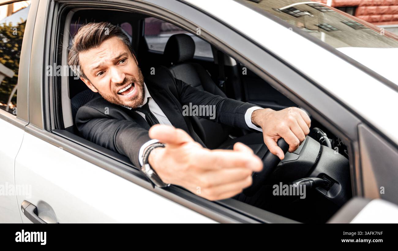 Mad man in suit screaming and gesturing while driving auto Stock Photo ...