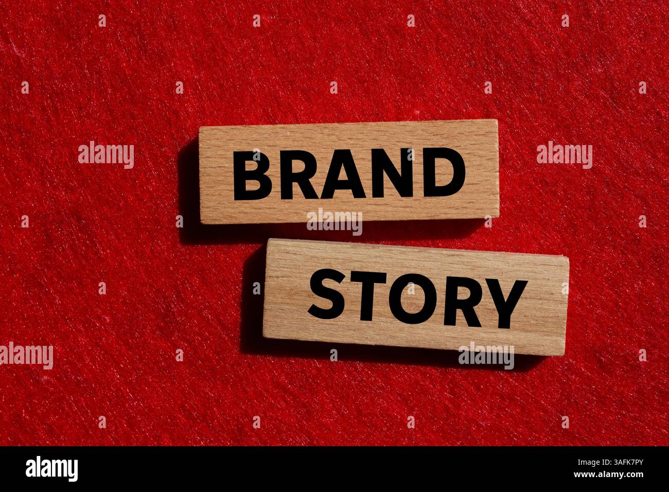 Brand story message written on wooden blocks on red background ...