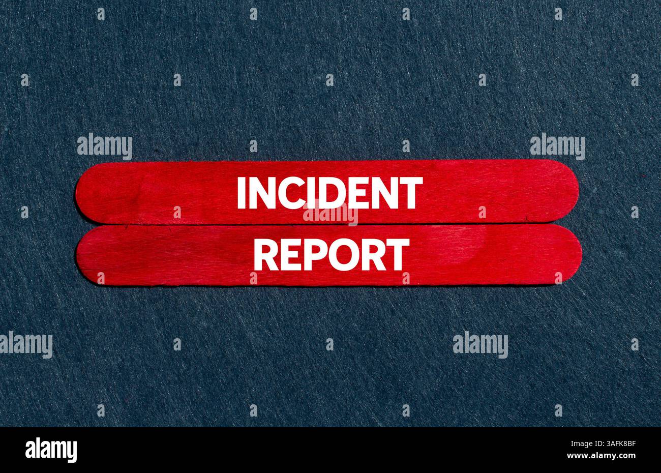 Incident report message written on red wooden sticks on gray background ...
