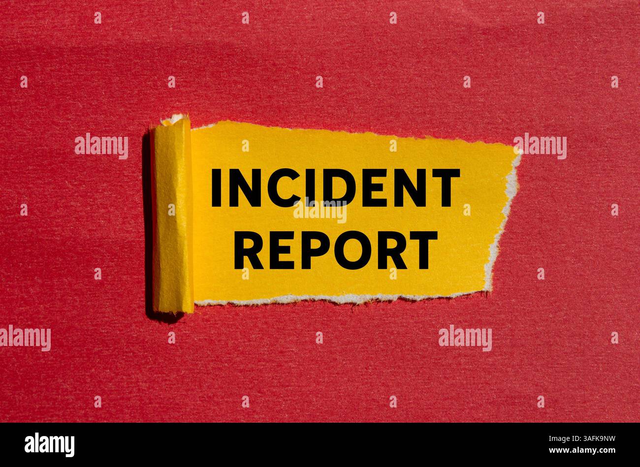 Incident report message written on ripped torn yellow paper on red background. Conceptual ...