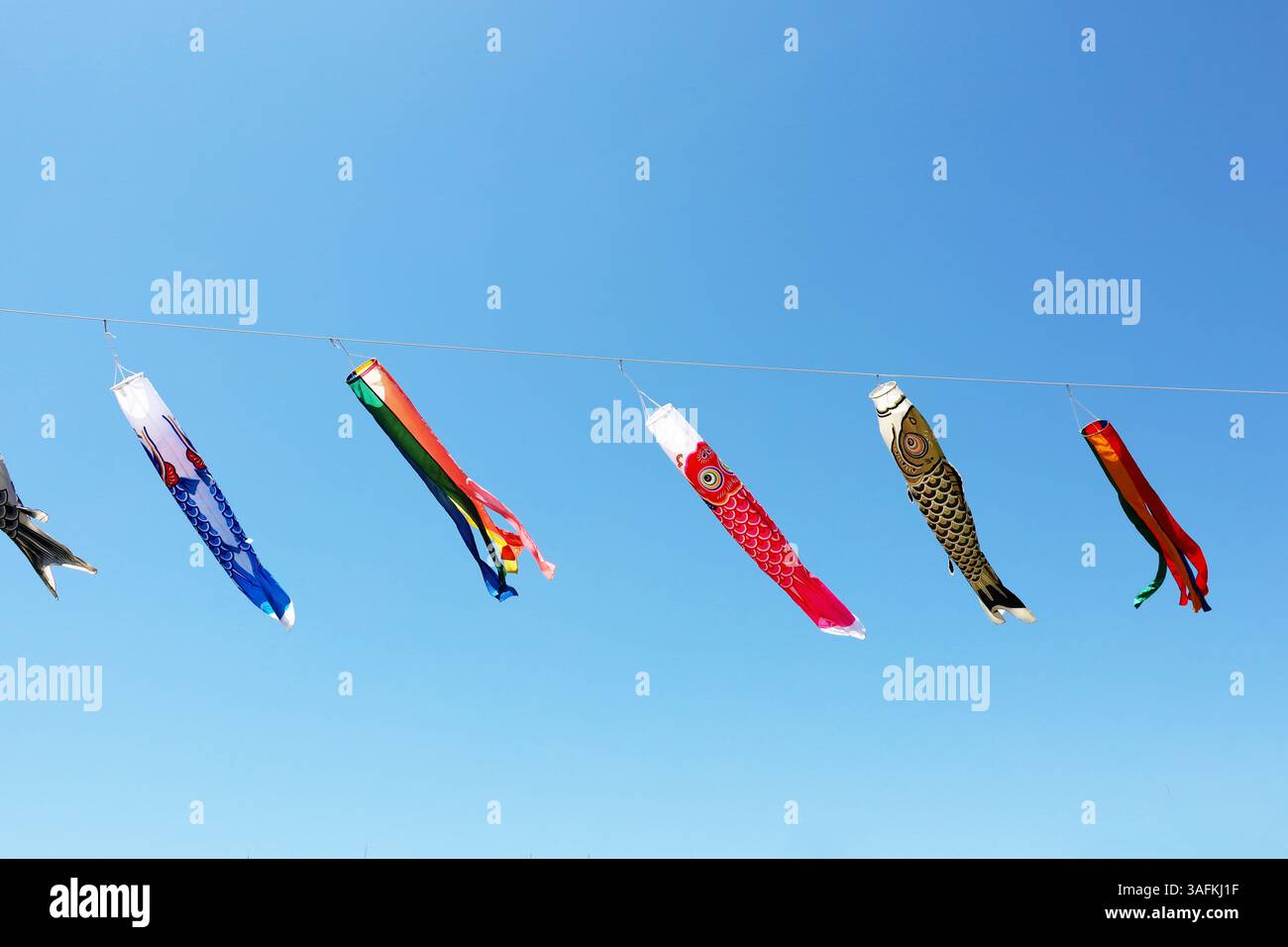 A blue clear sky and a Carp streamer swaying in the wind Stock Photo ...