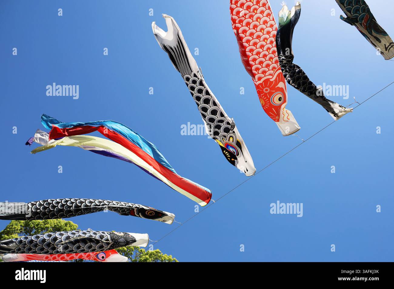 A blue clear sky and a Carp streamer swaying in the wind Stock Photo ...
