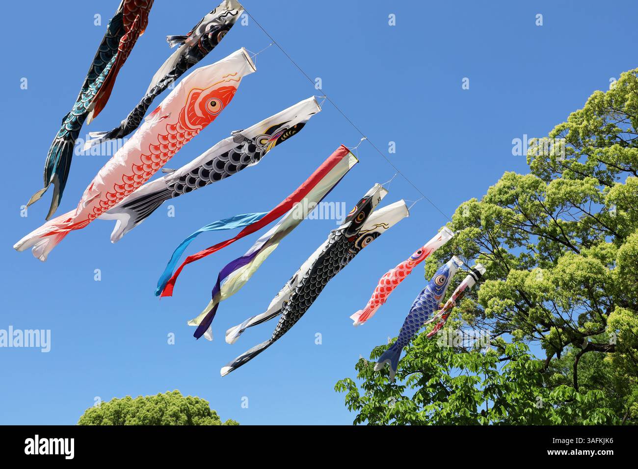 A blue clear sky and a Carp streamer swaying in the wind Stock Photo ...