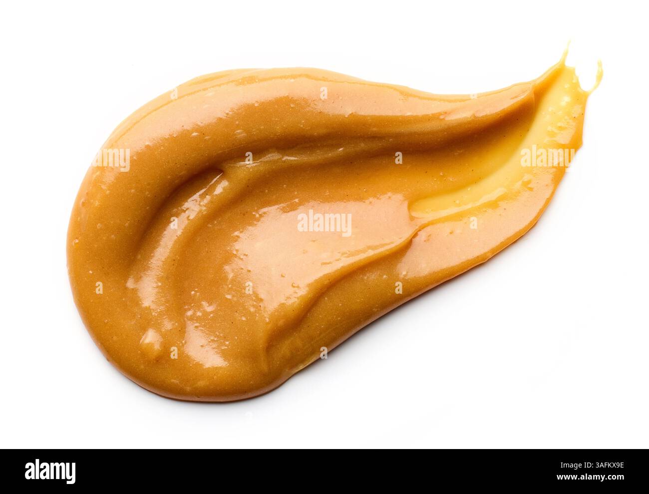 Smear of tasty caramel paste on white background, top view Stock Photo ...