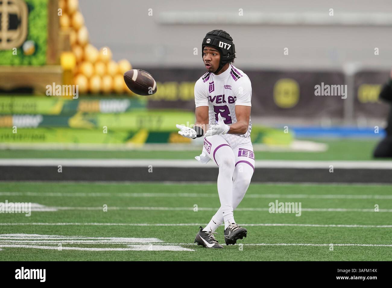 Level82 wide receiver Travis Johnson reaches out for a pass during an ...