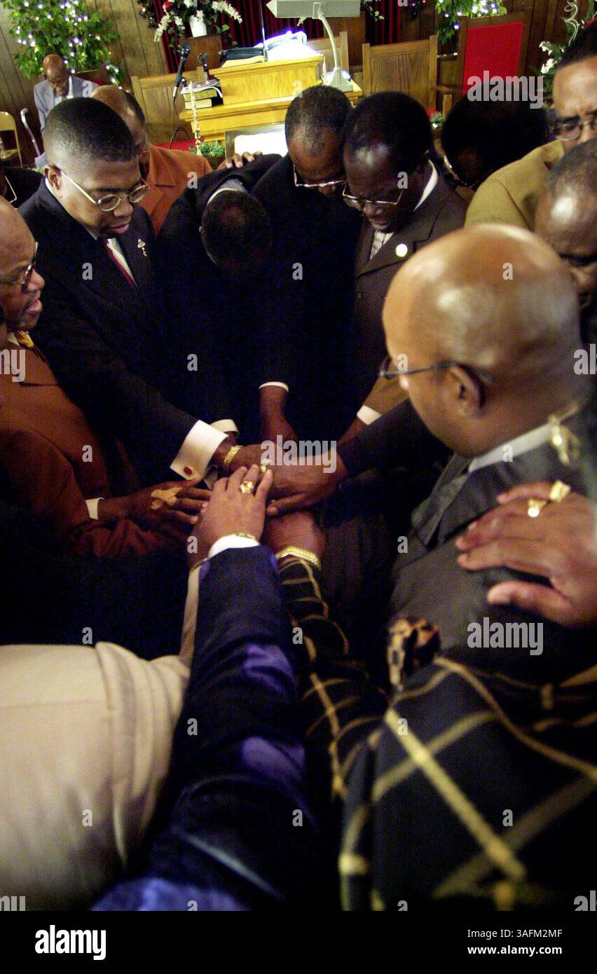 Pastors and Ministers from around the nation ''Lay hands'' on Rev. Henry J. Lyons anointing him ...