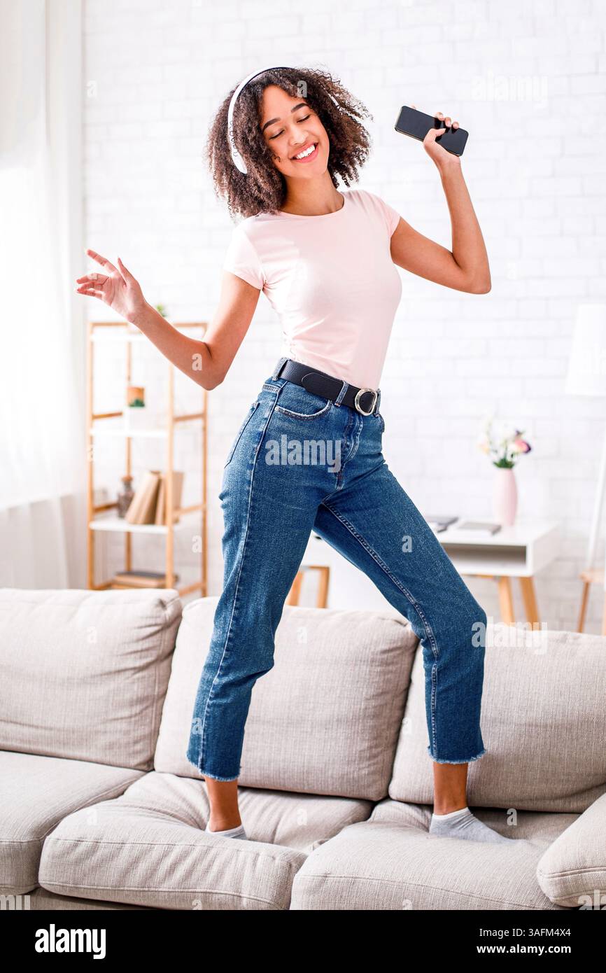 African american girl enjoying musical break at work remotely Stock ...