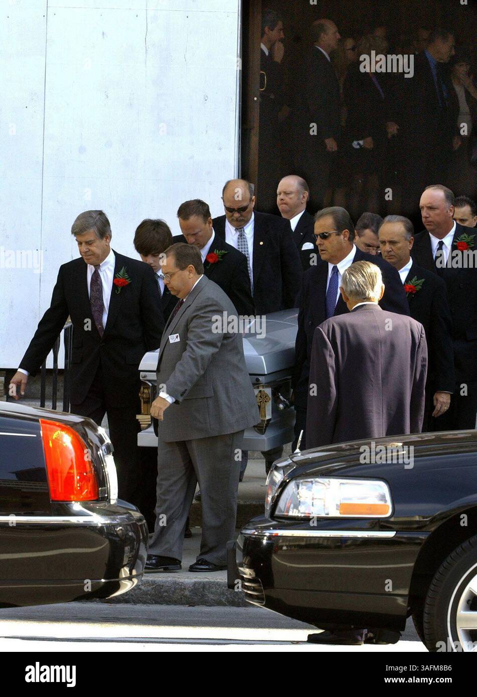 The casket bearing Chris Thomas is carried out of Sacred Heart Catholic ...