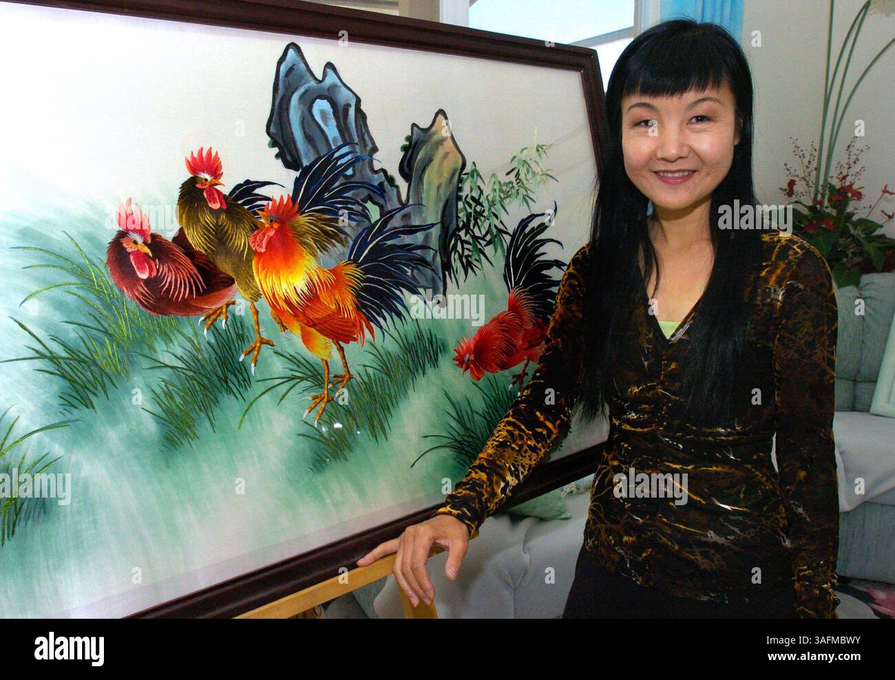 1) Ping Chen (cq) stands by ''New Day for the New Life,'' one of the ...