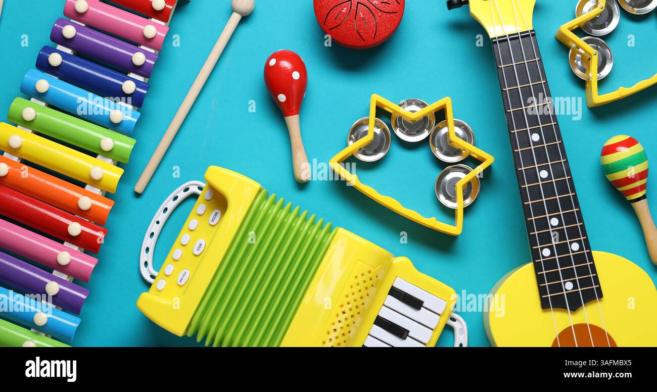 Flat lay composition with different toy musical instruments on light ...