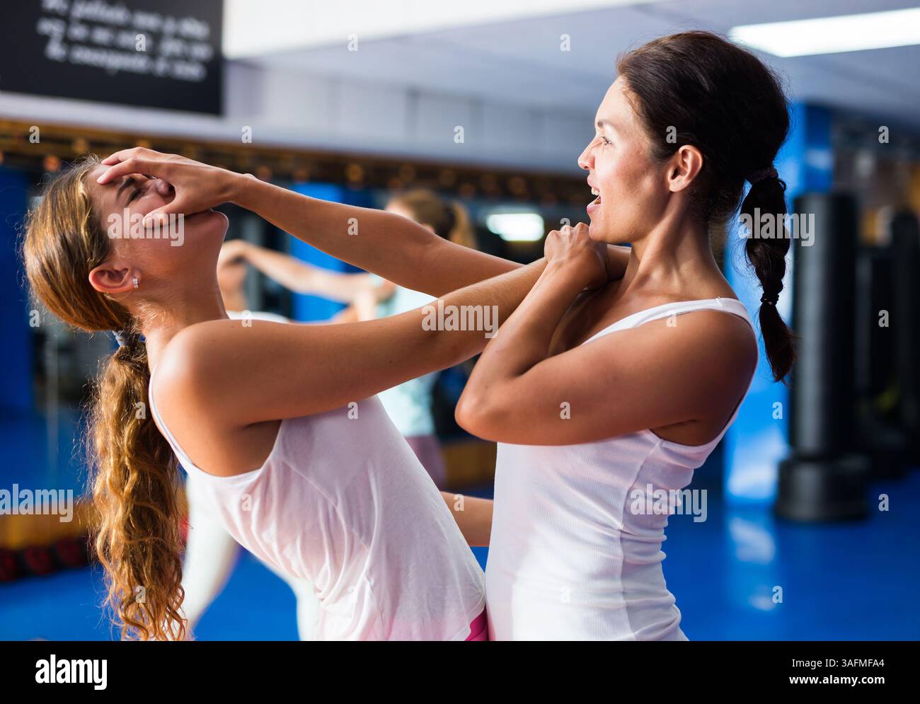 Women doing self protection movements Stock Photo - Alamy