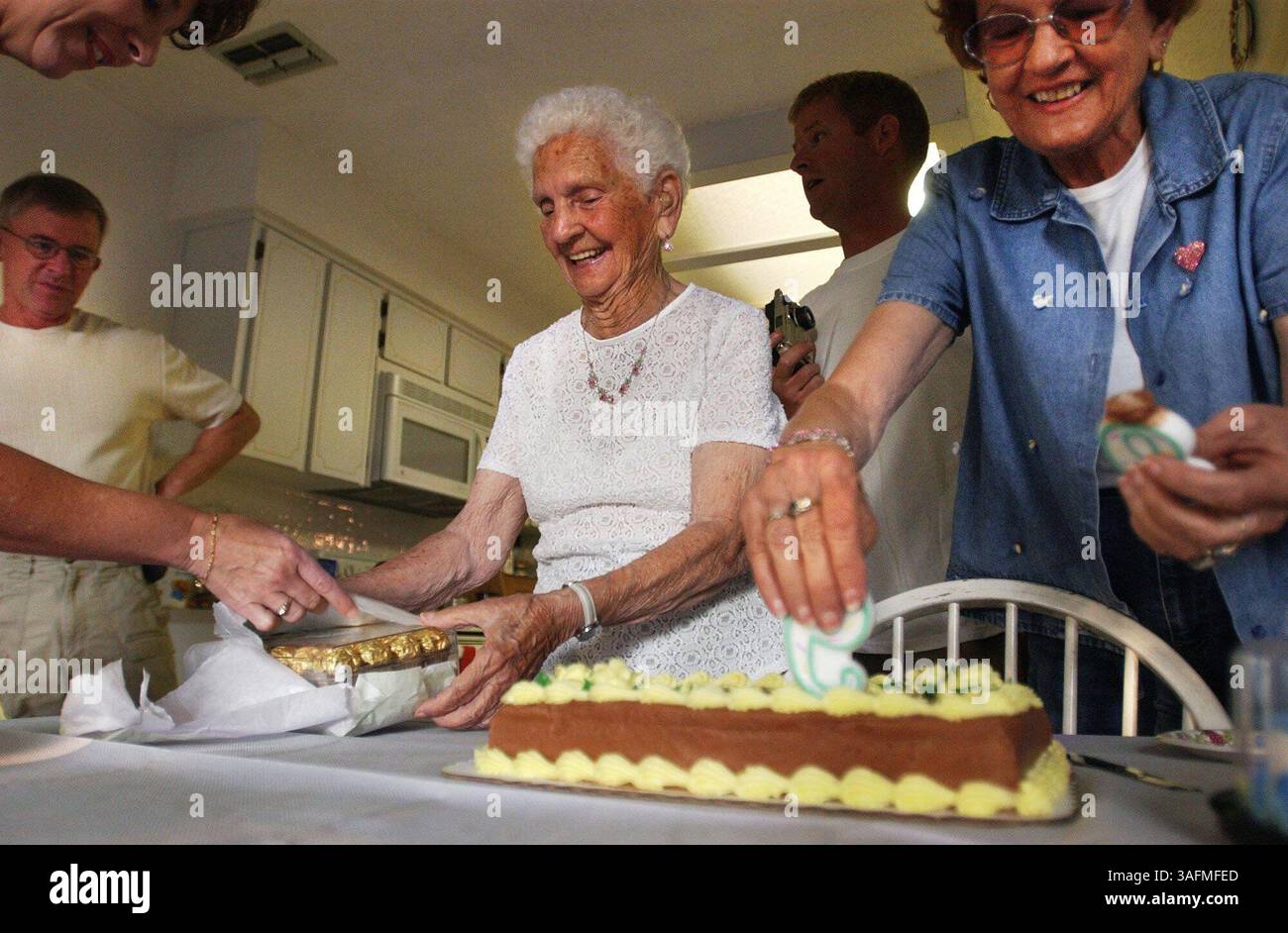 5/13/2004-- Ellen Trenary of Safety Harbor, opens a gift of chocolate ...