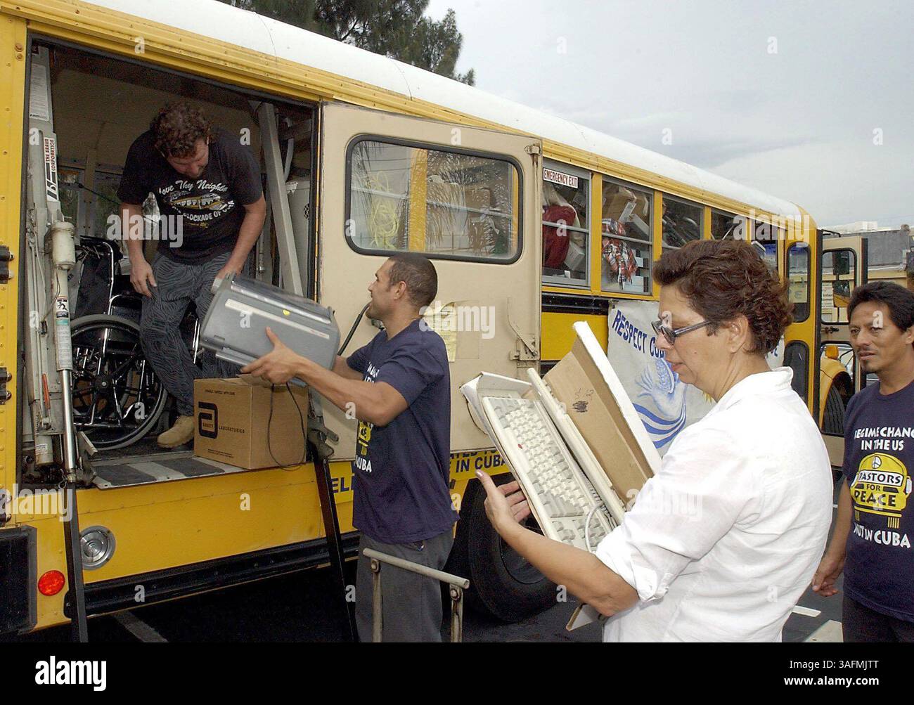 Left to right) Michael Canney (cq) and Miguel Gallardo (cq), volunteers ...