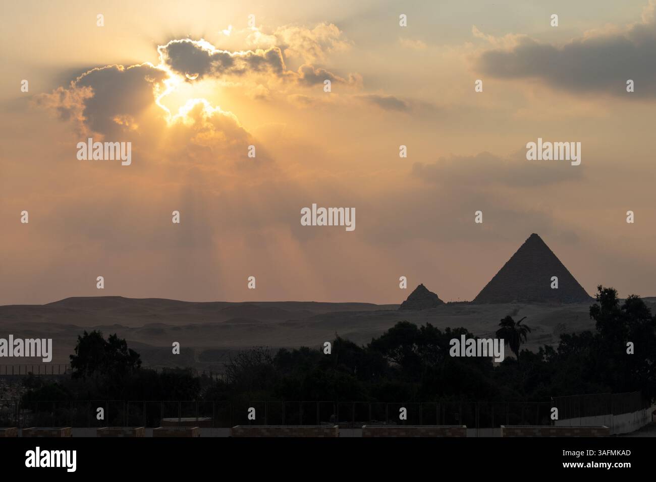 Beautiful colourful sunset over Great Pyramids complex, pyramid of ...