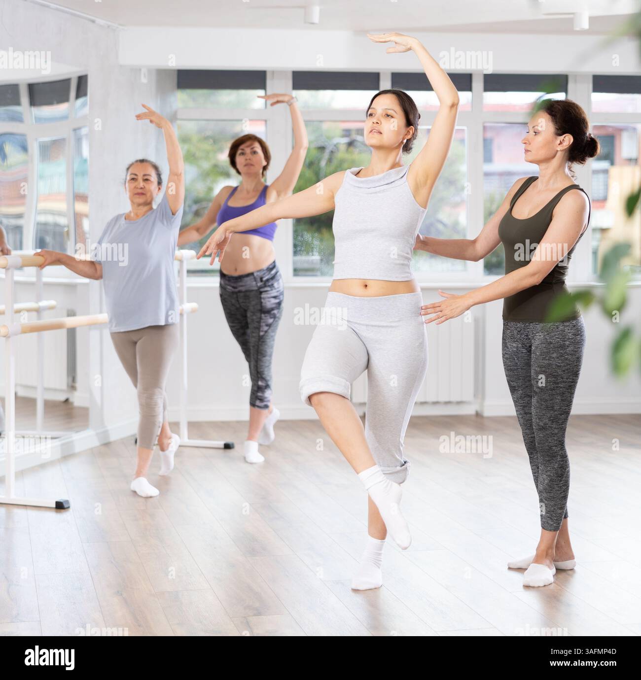 Asian woman learning basics of ballet with female instructor Stock Photo - Alamy
