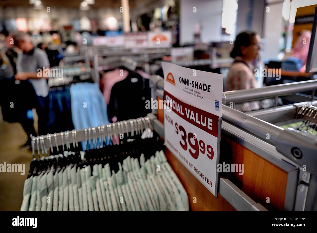 People shop the discounts at a Columbia clothing store at the Citadel ...