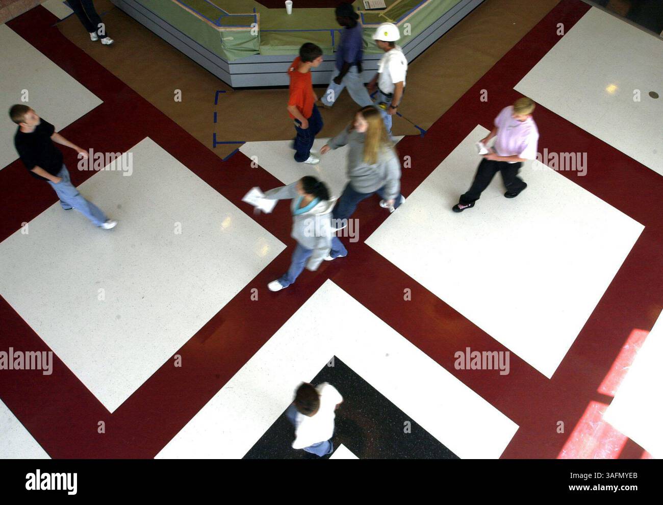 Students pass front desk hi-res stock photography and images - Alamy